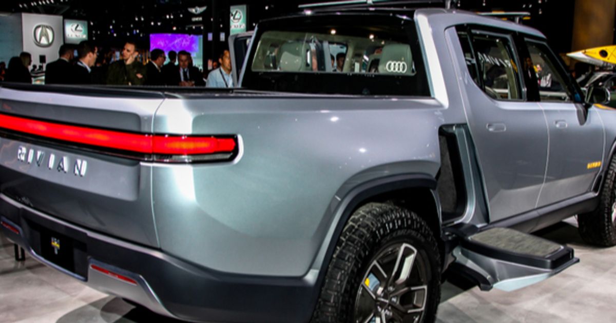Rivian posts first gross profit but cuts 2025 delivery outlook | NASDAQ ...