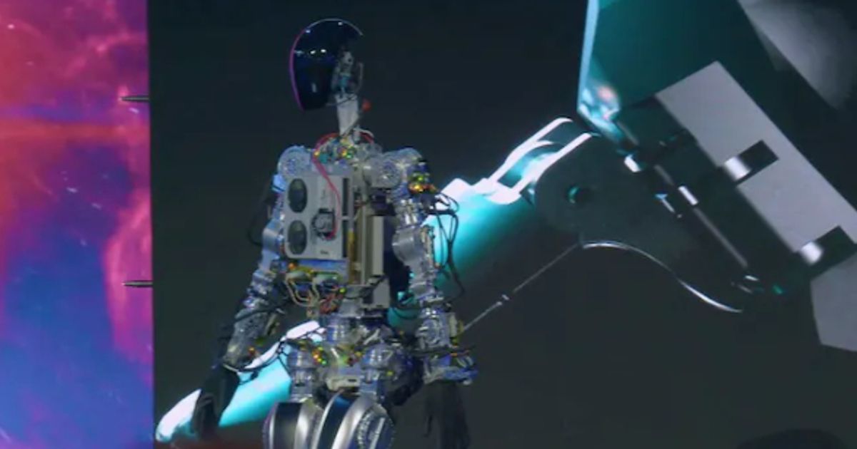 Tesla shows off early prototype of humanoid robot Optimus